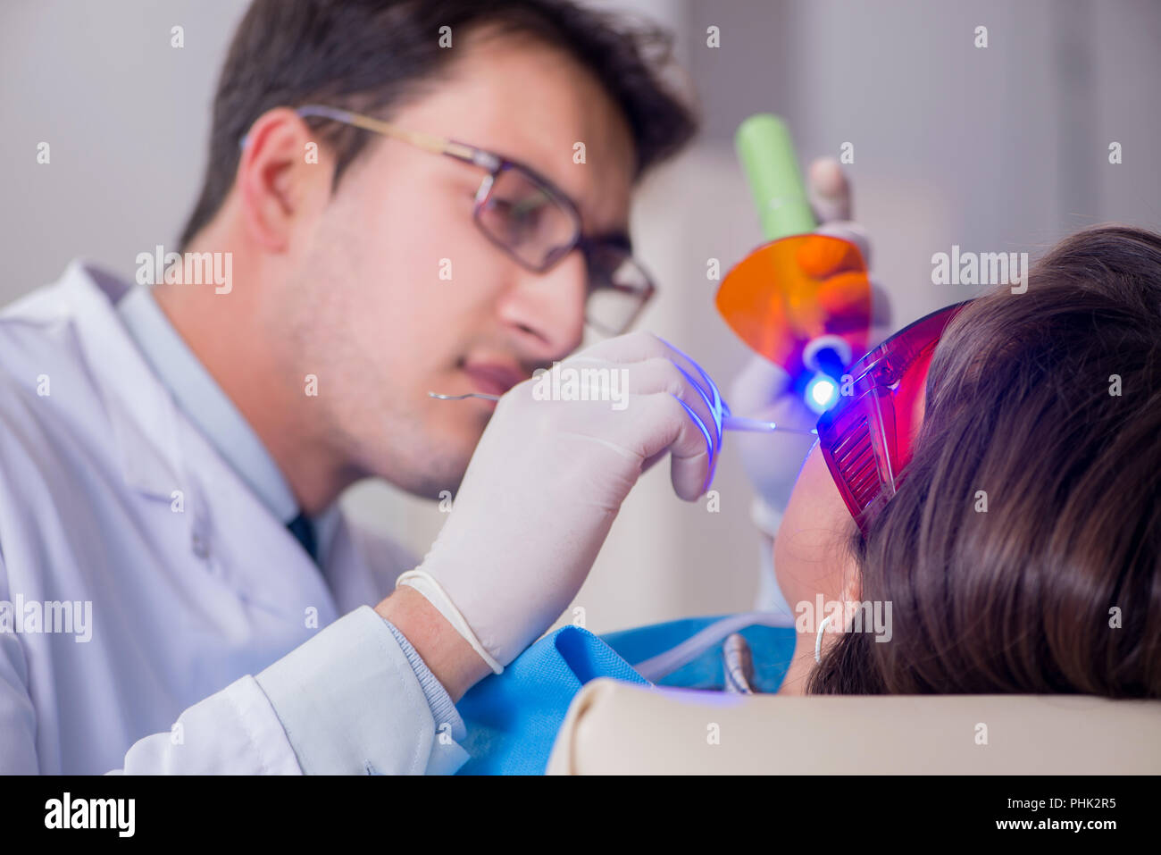 Patient visiting dentist for regular check-up and filling Stock Photo ...