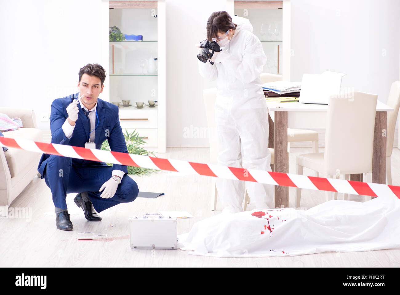 Forensics investigator at the scene of office crime Stock Photo - Alamy