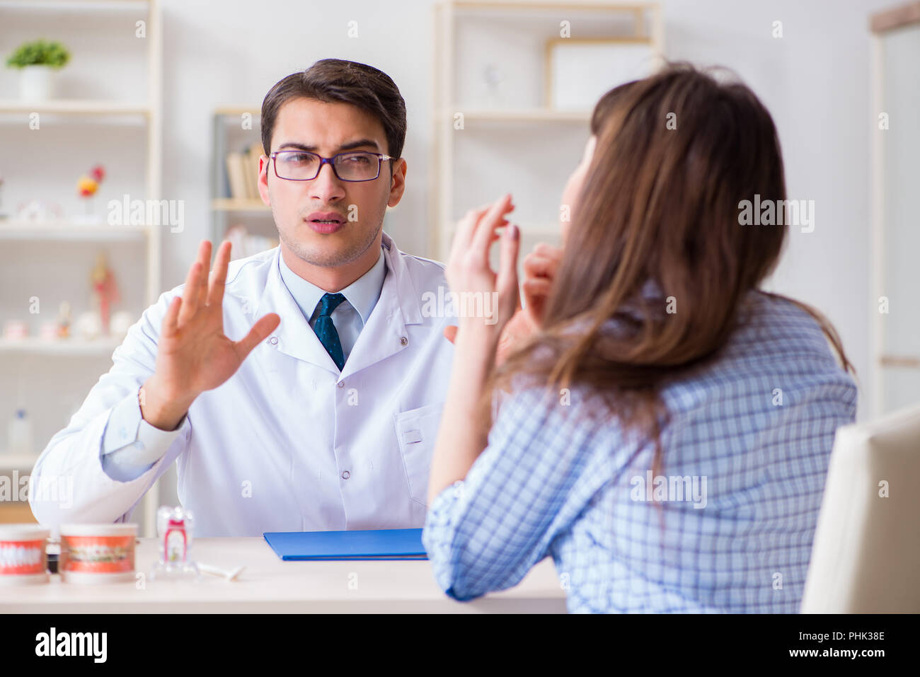 Patient visiting dentist doctor for preliminary appointment Stock Photo ...