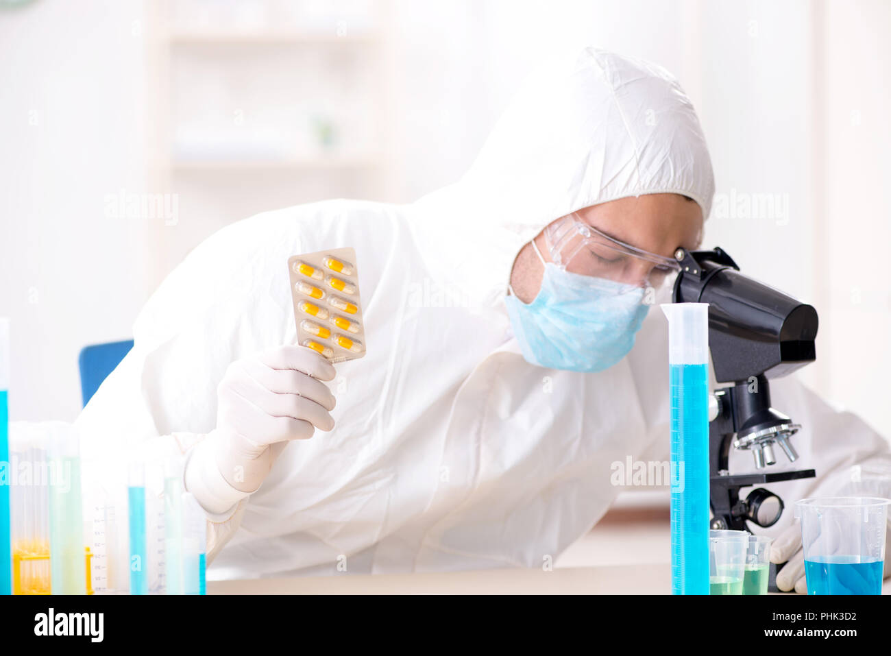 Lab assistant in drug synthesis concept Stock Photo - Alamy