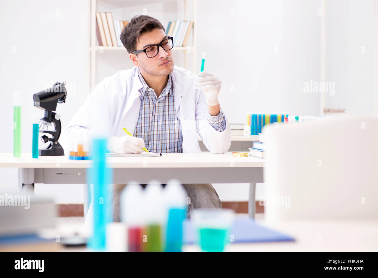 Chemistry student doing chemical experiments at classroom activi Stock ...