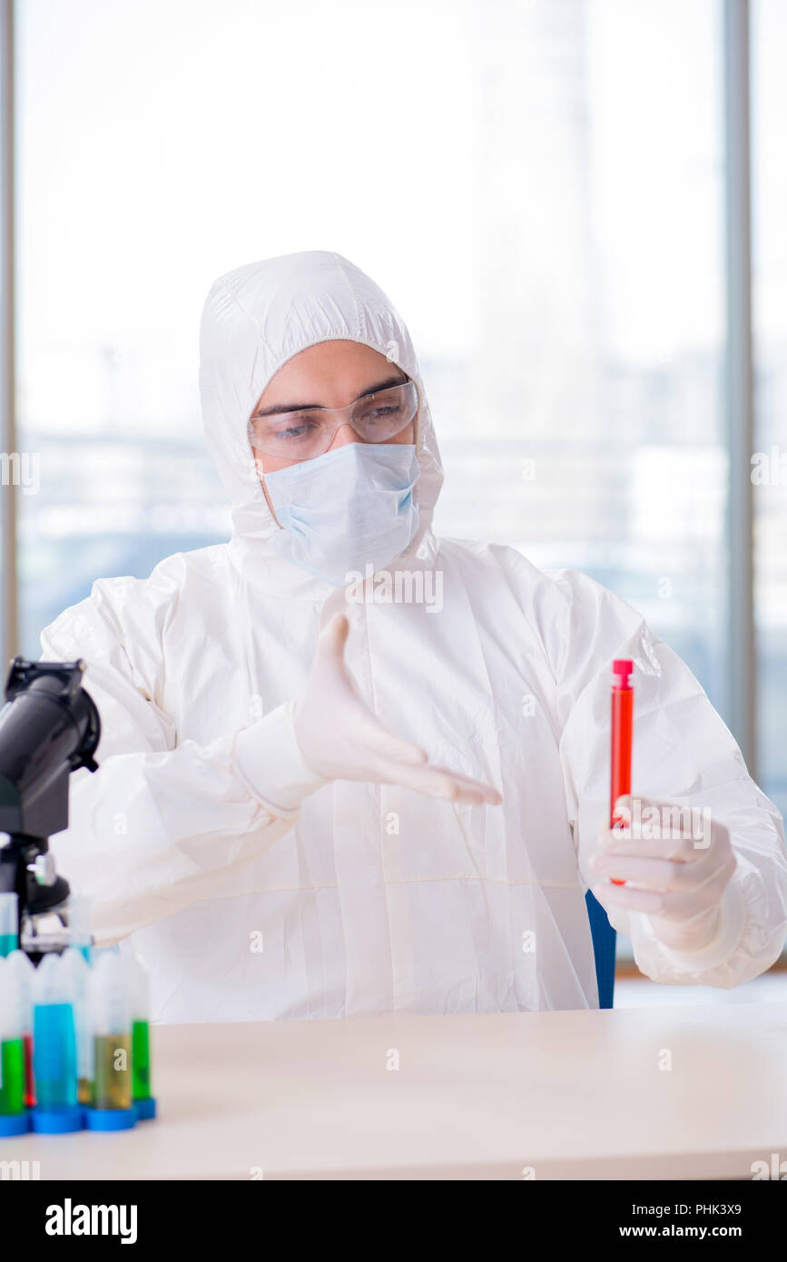 Man doctor checking blood samples in lab Stock Photo - Alamy