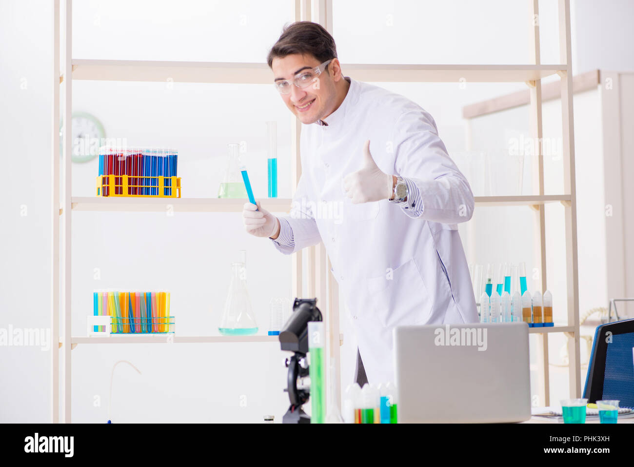 Man student working in chemical lab on experiment Stock Photo - Alamy