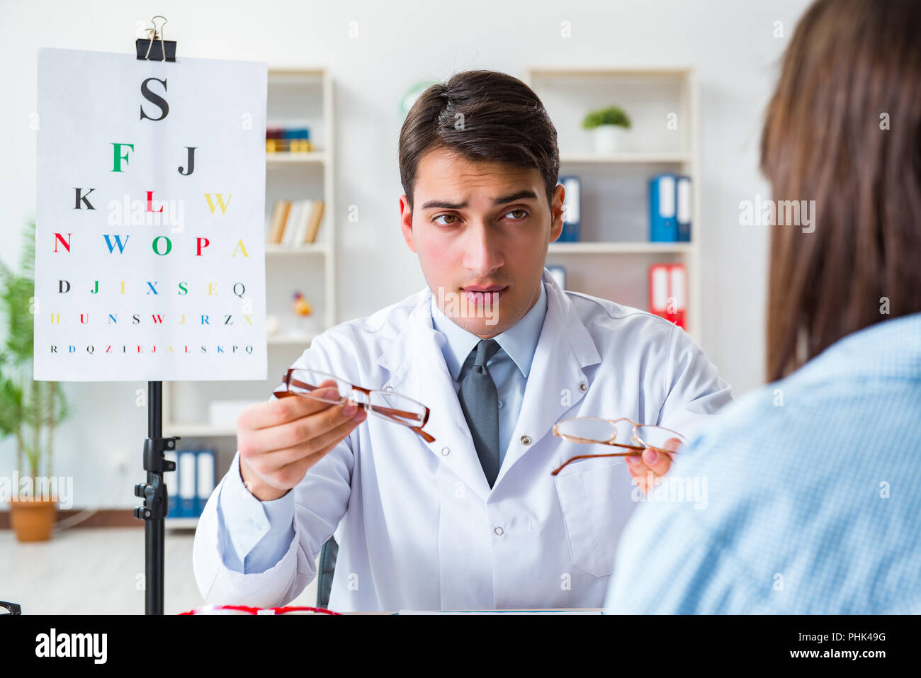 Doctor with patient at eye exam Stock Photo - Alamy