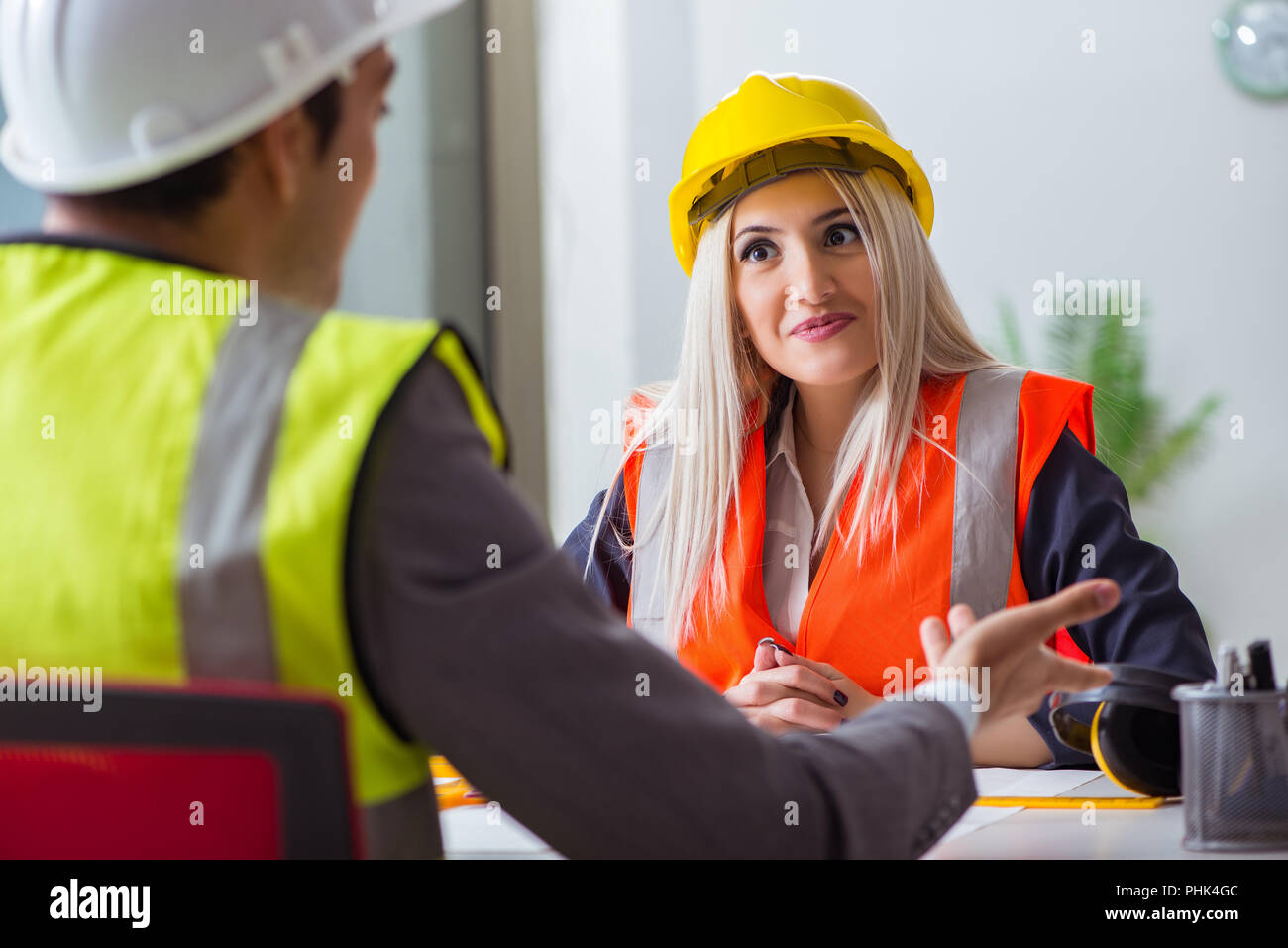 Construction workers having discussion in office before starting Stock ...