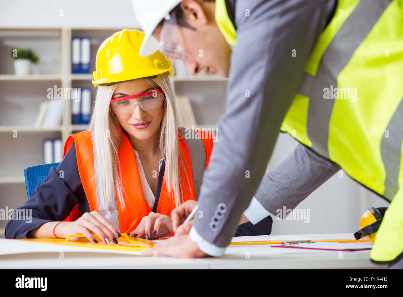 Construction workers having discussion in office before starting Stock ...