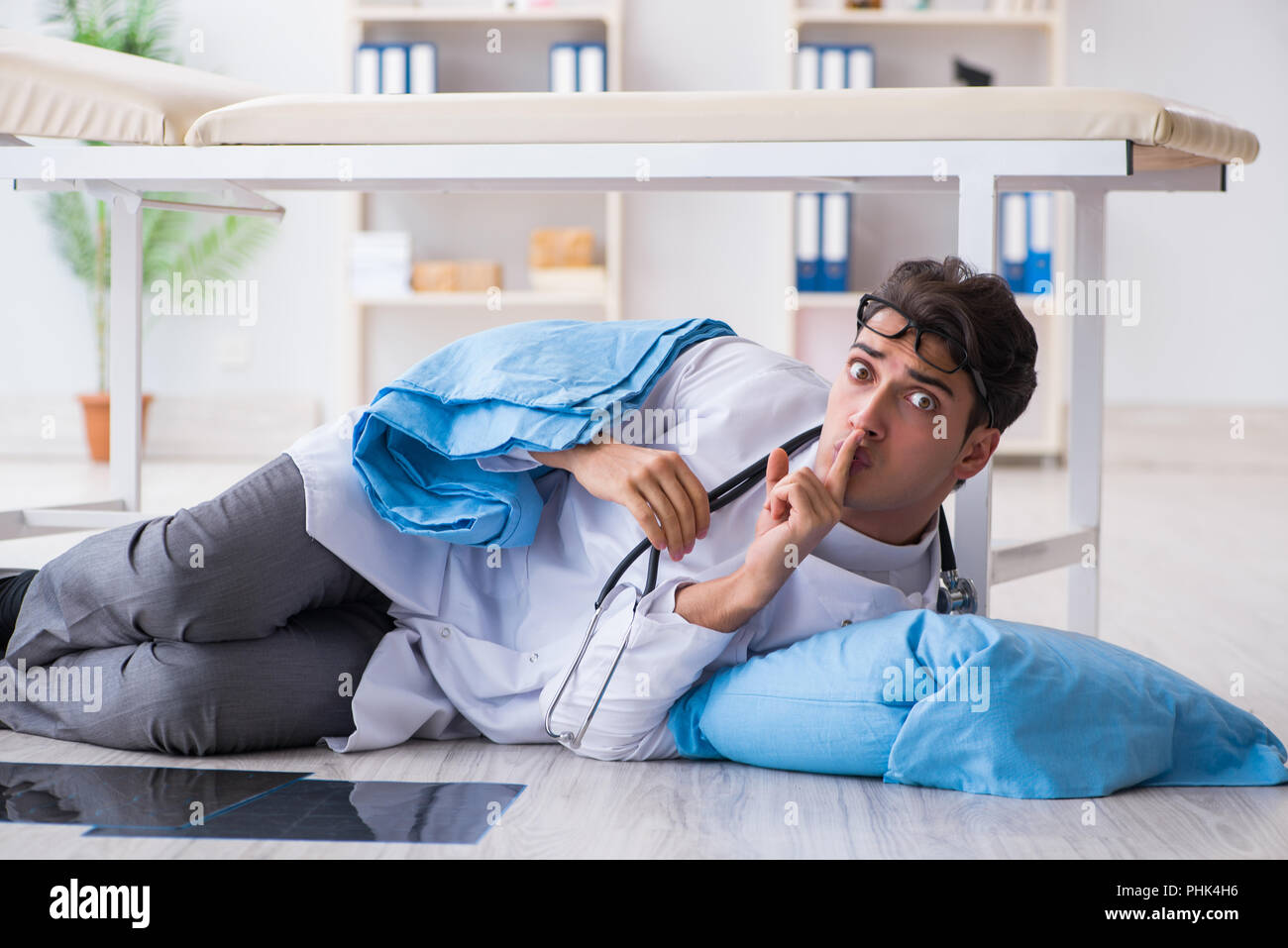 Doctor sleeping on floor after long night shift Stock Photo - Alamy