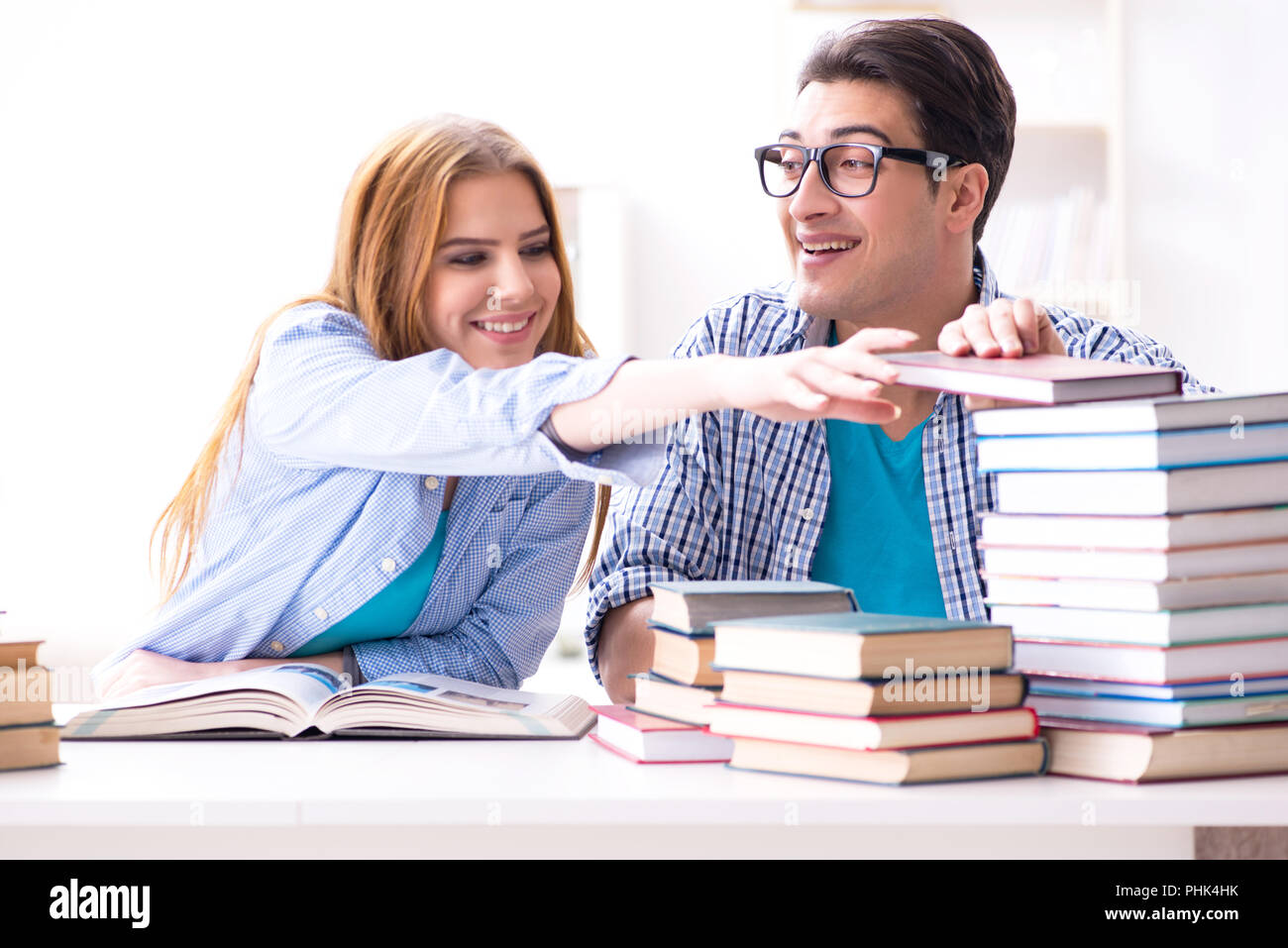Pair of students studying for university exams Stock Photo - Alamy