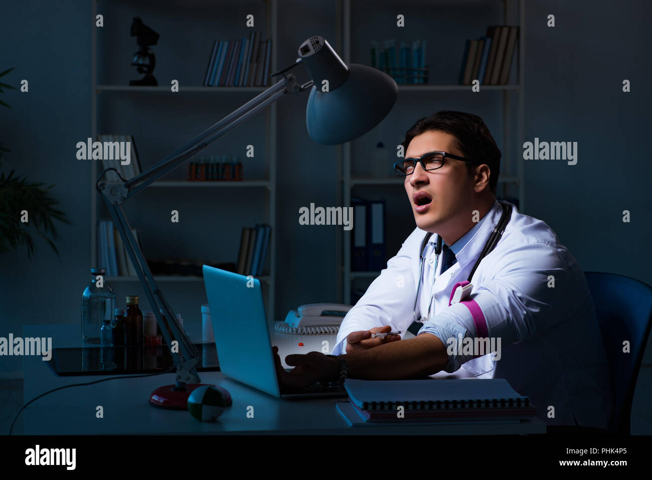 Doctor drug addict staying late on hospital Stock Photo - Alamy