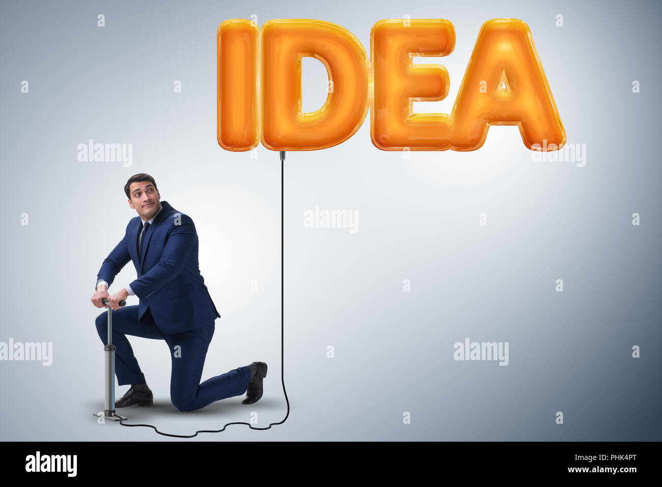 Businessman pumping innovative idea balloon Stock Photo - Alamy
