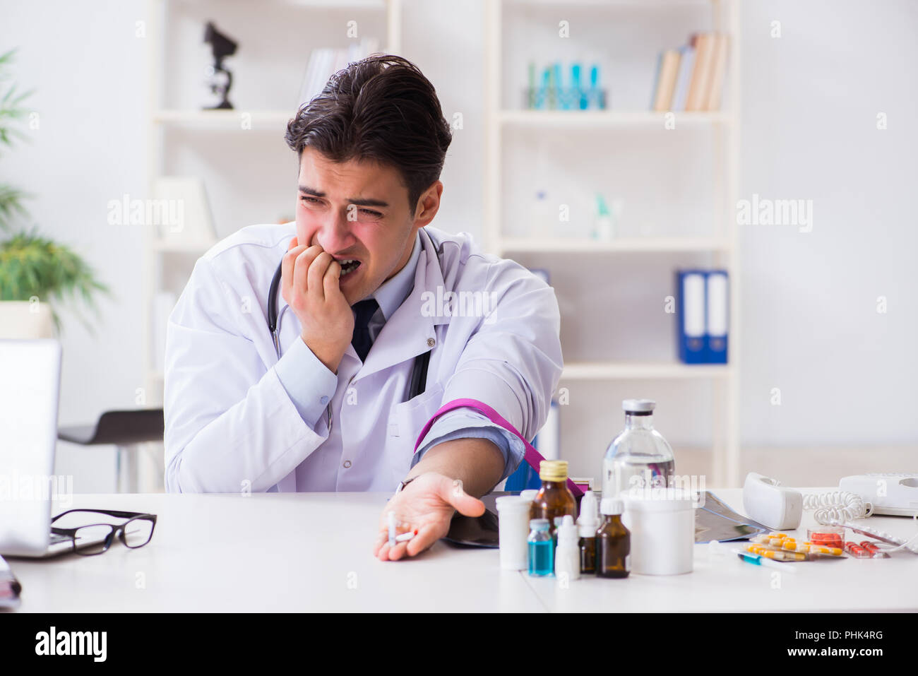 Doctor drug addict in the hospital Stock Photo - Alamy