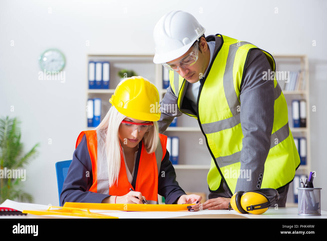 Construction workers checking drawing hi-res stock photography and ...