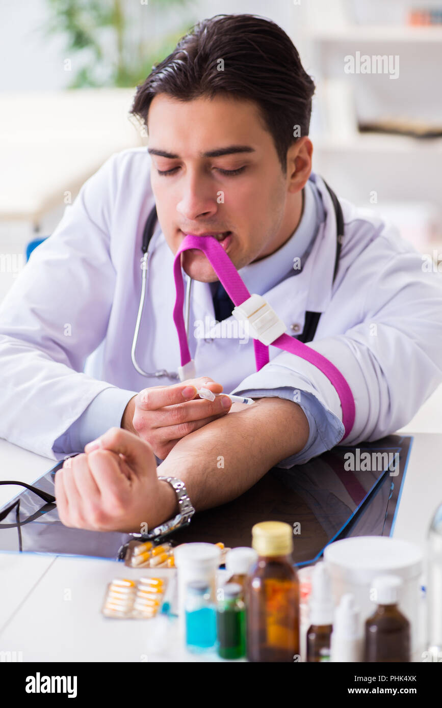 Doctor drug addict in the hospital Stock Photo - Alamy