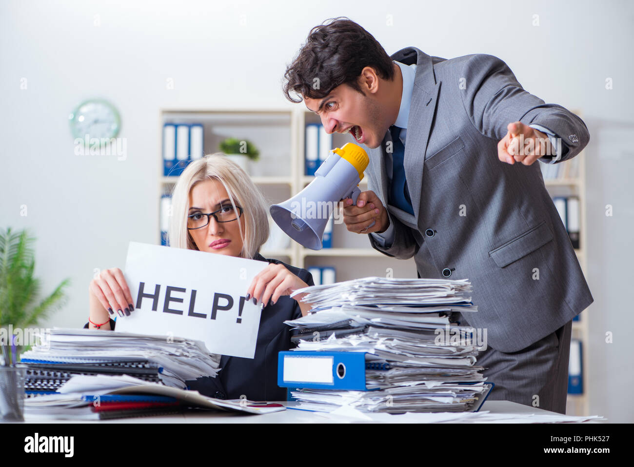 Angry boss yelling at his assistant secretary hi-res stock photography ...