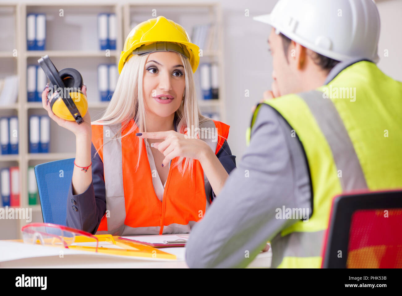 Construction workers having discussion in office before starting Stock ...