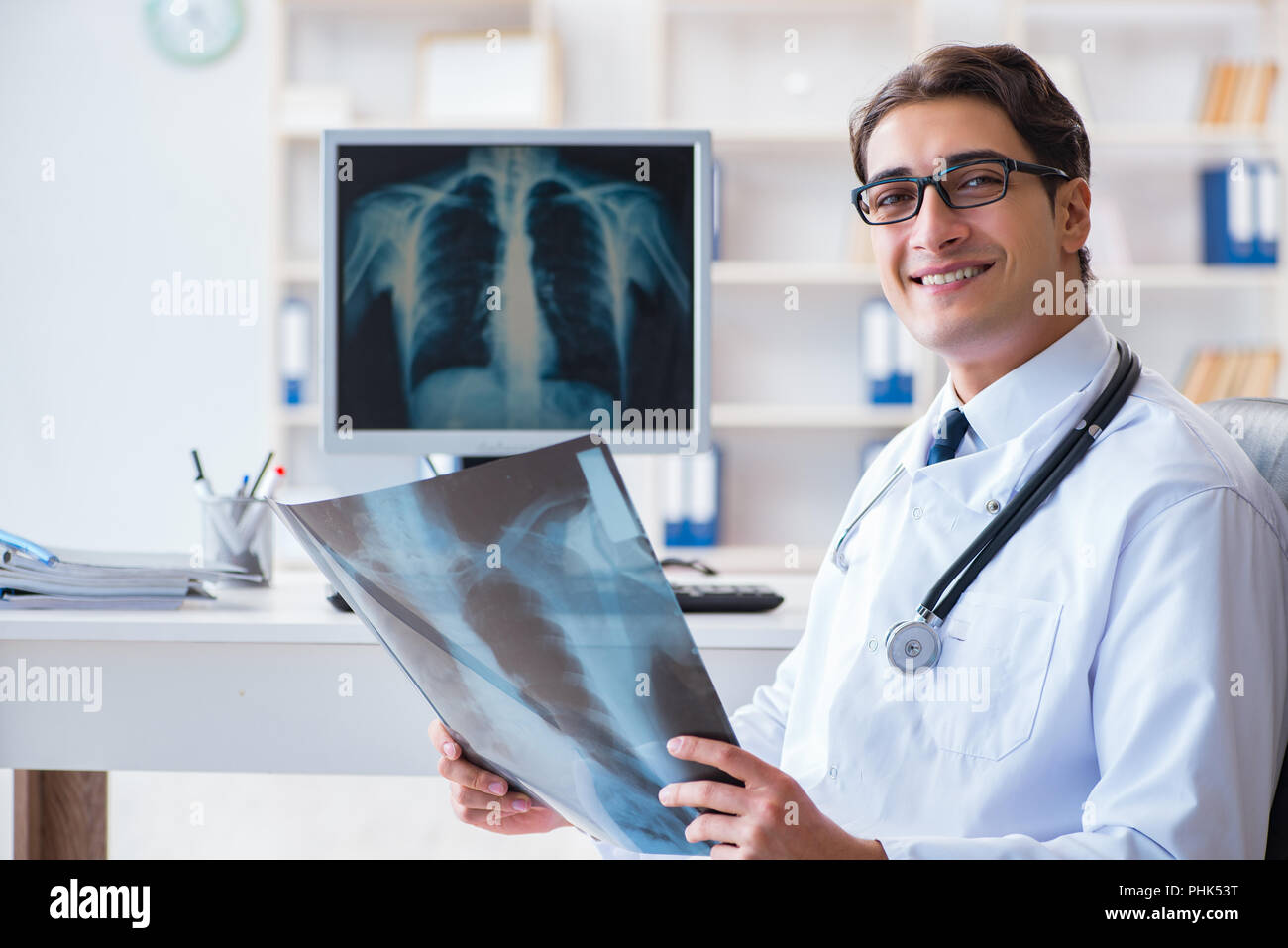 Doctor radiologist looking at x-ray images Stock Photo - Alamy