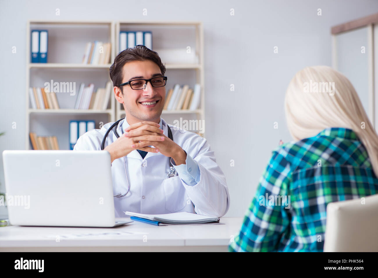 Patient visiting doctor for medical check-up in hospital Stock Photo ...