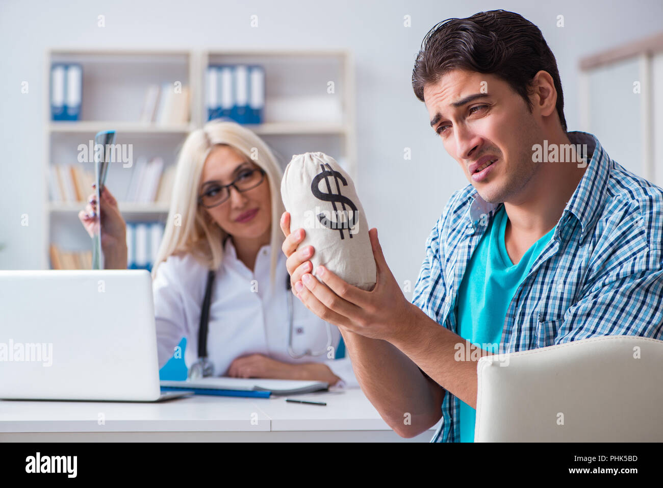 Male patient angry at expensive healthcare bill Stock Photo - Alamy