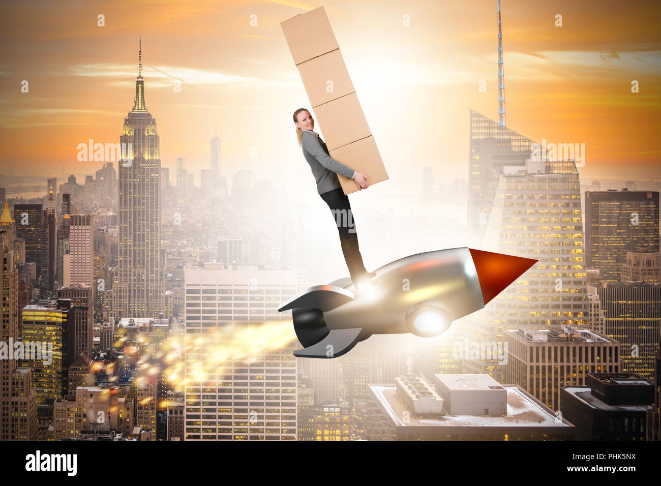 Woman flying rocket and delivering boxes Stock Photo - Alamy