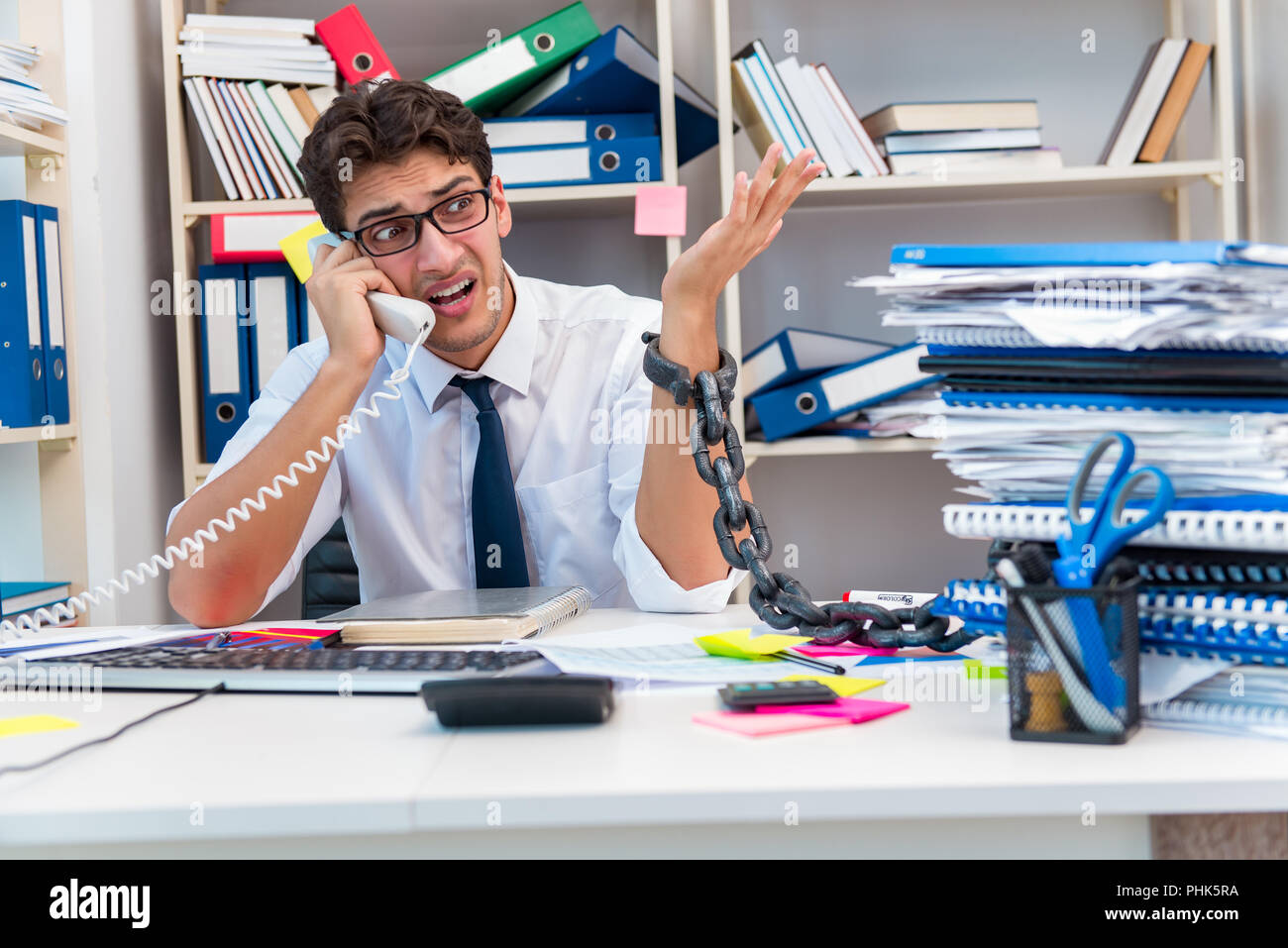Chained to the desk hi-res stock photography and images - Alamy
