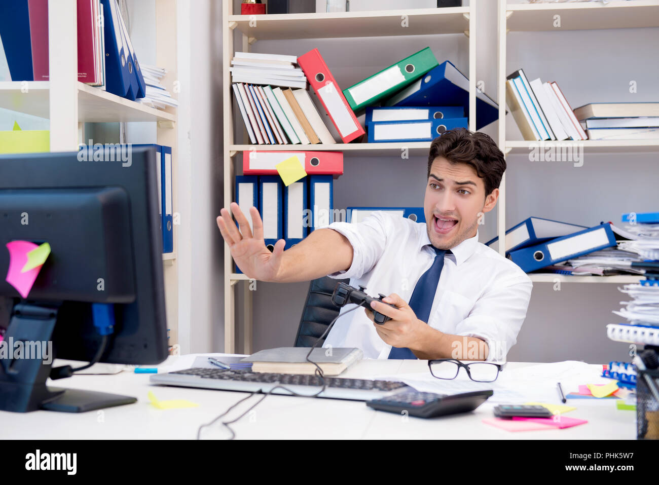 Employee playing computer games in the office Stock Photo - Alamy
