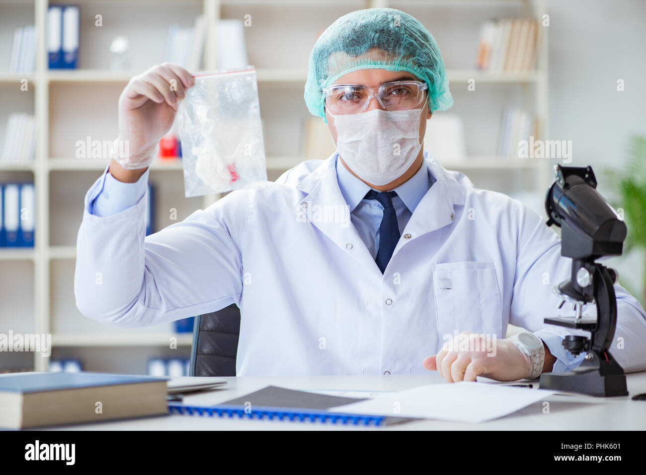 Forensics investigator working in lab on crime evidence Stock Photo - Alamy