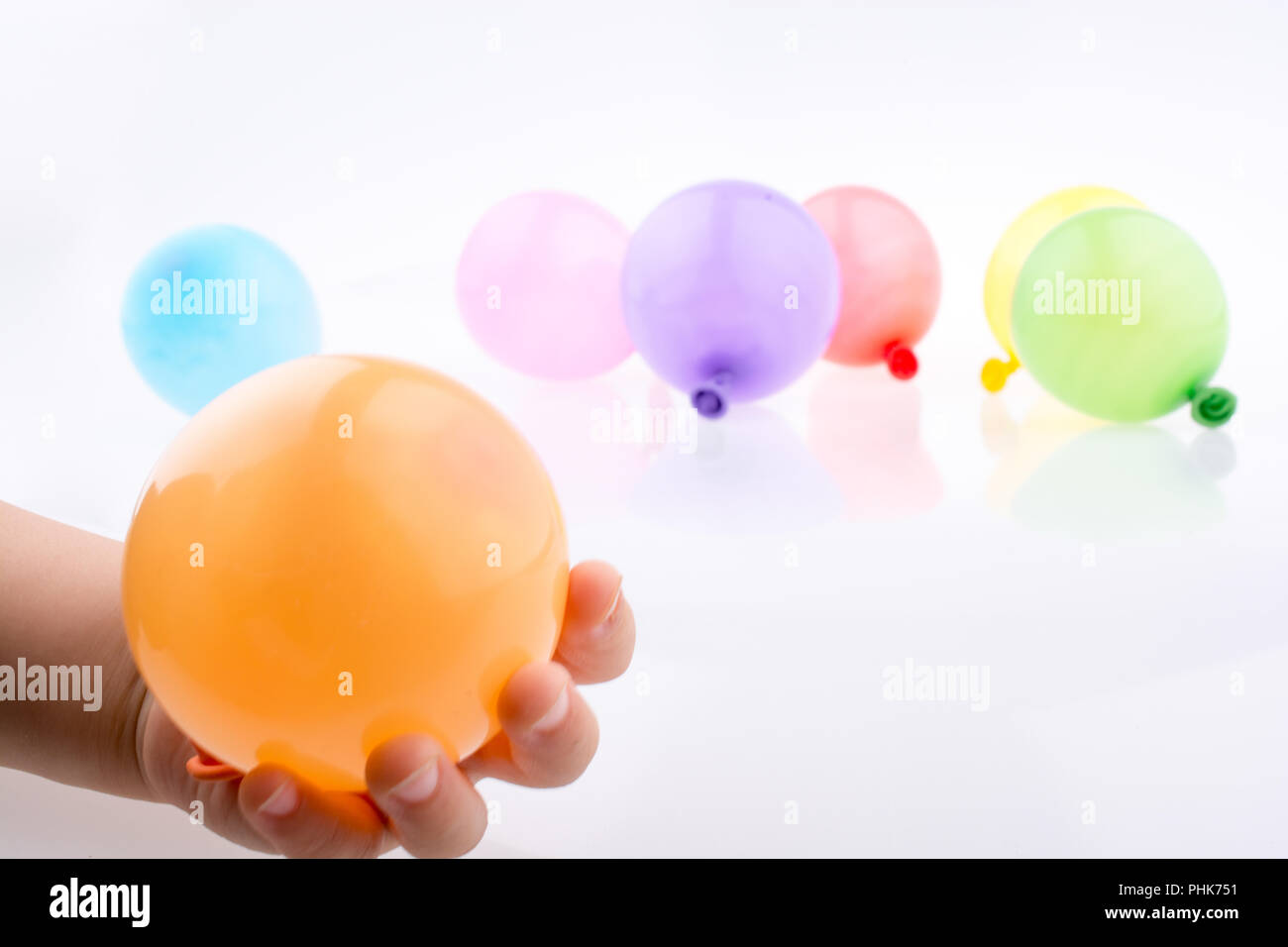 Hand holding balloons hi-res stock photography and images - Alamy