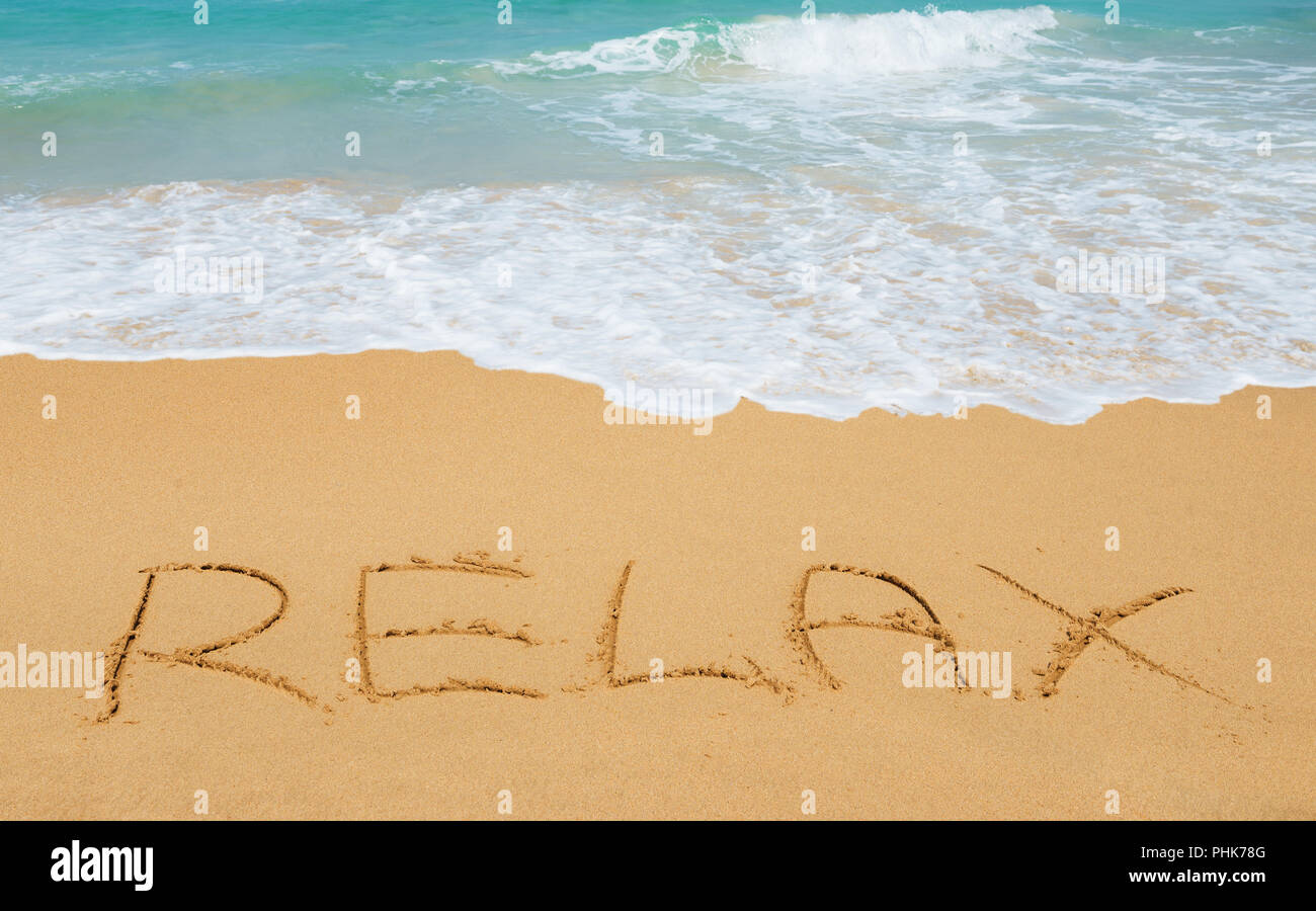 Relax message on the beach sand Stock Photo - Alamy