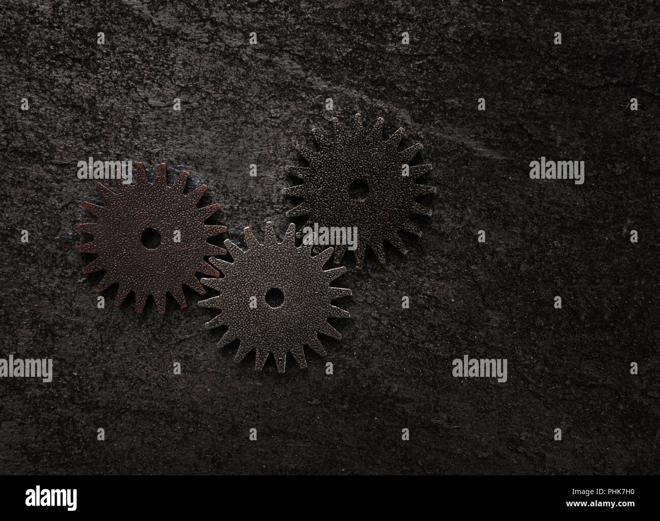 Three metal gears Stock Photo - Alamy