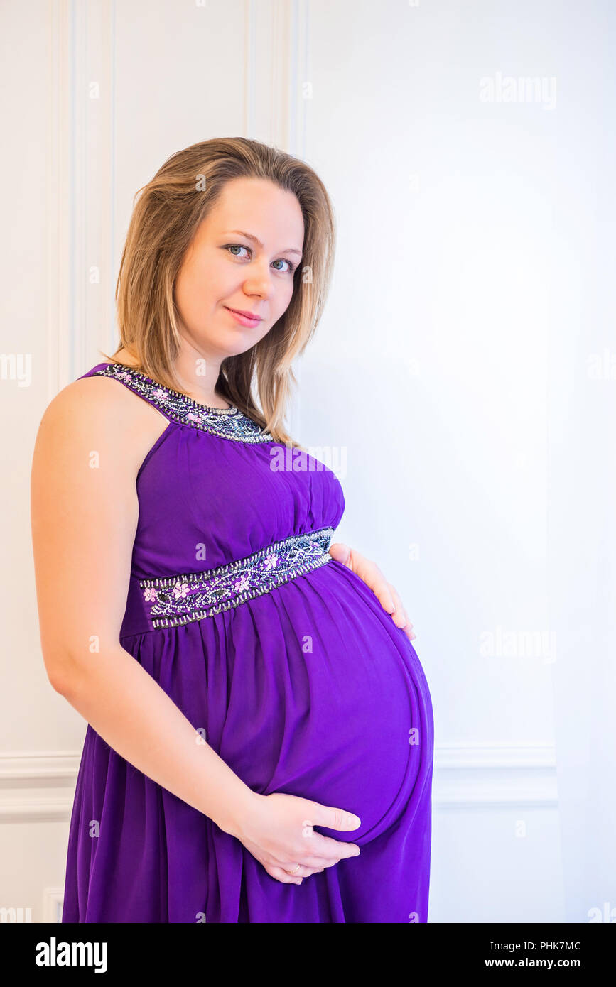 Beautiful pregnant woman standing Stock Photo - Alamy