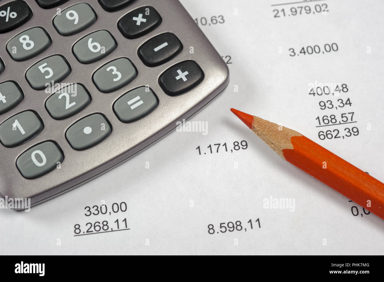 financial invoice with calculator and pen Stock Photo - Alamy