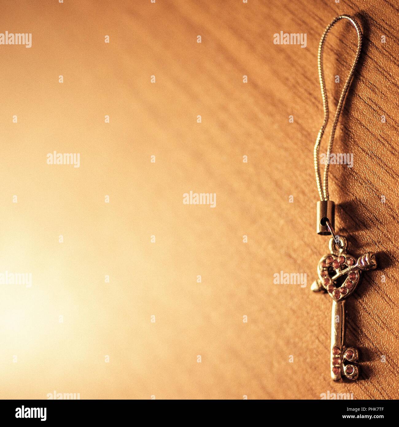 small key with heart and arrow on the table Stock Photo - Alamy