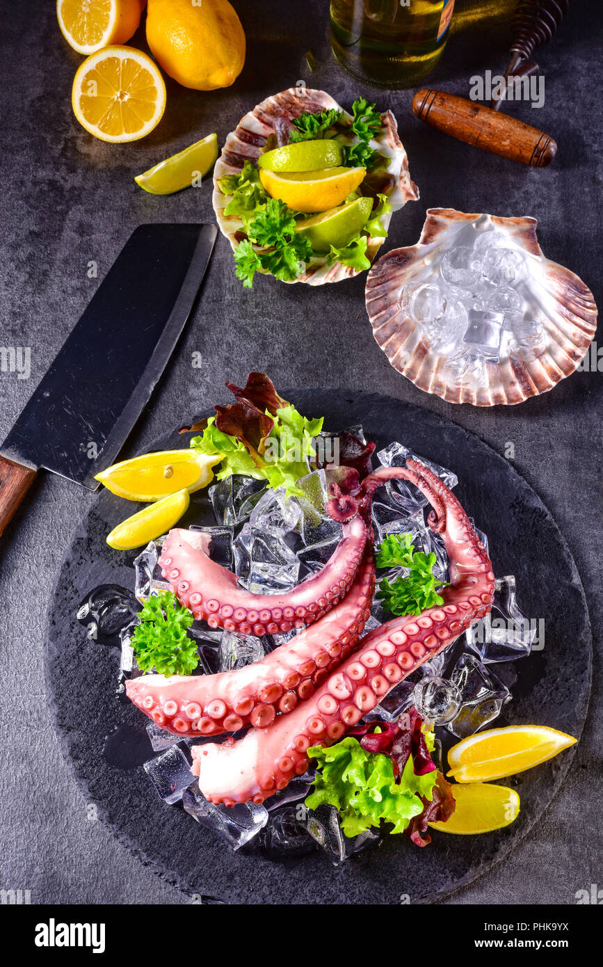 raw octopus on the ice Stock Photo - Alamy