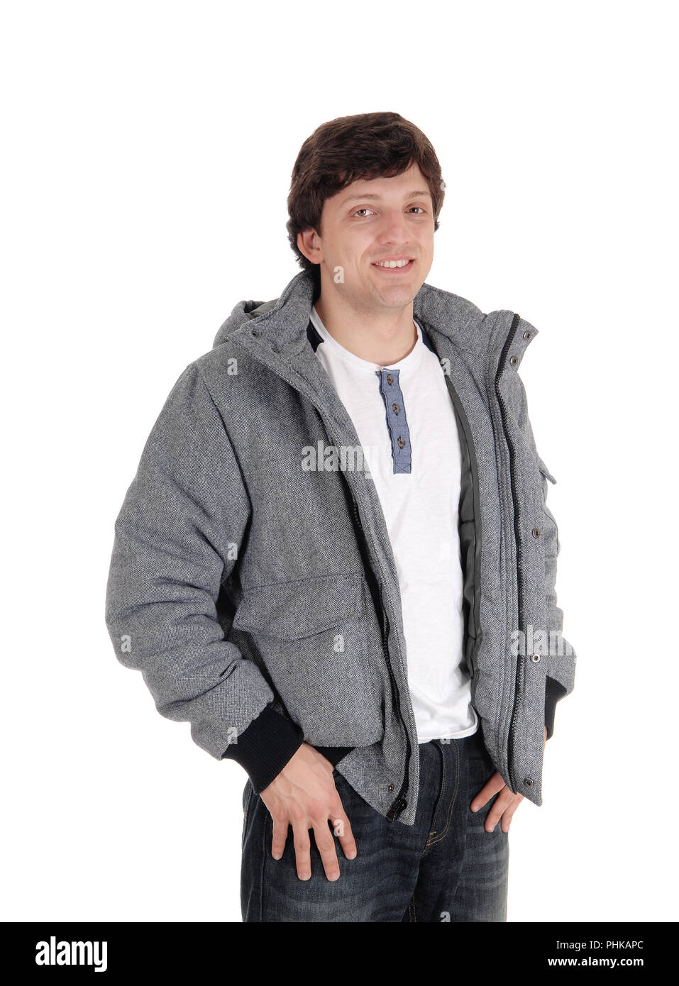 Serious looking young man standing Stock Photo - Alamy