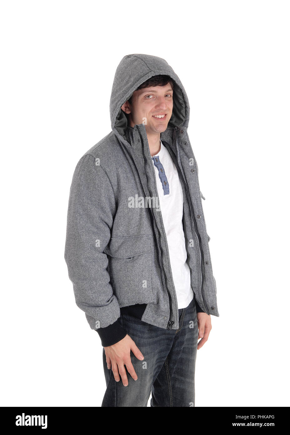 Caucasian young man standing in a hoody Stock Photo - Alamy