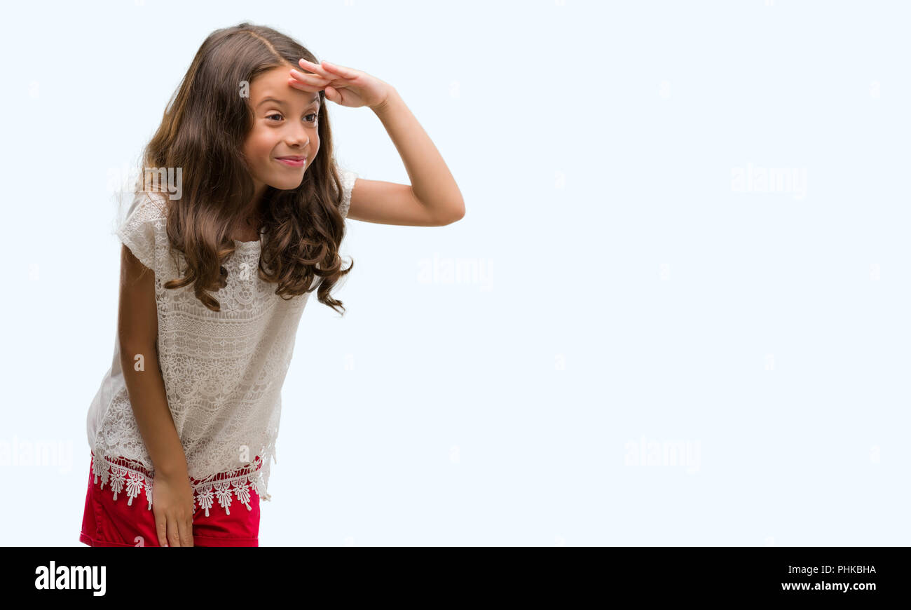 Brunette hispanic girl very happy and smiling looking far away with ...