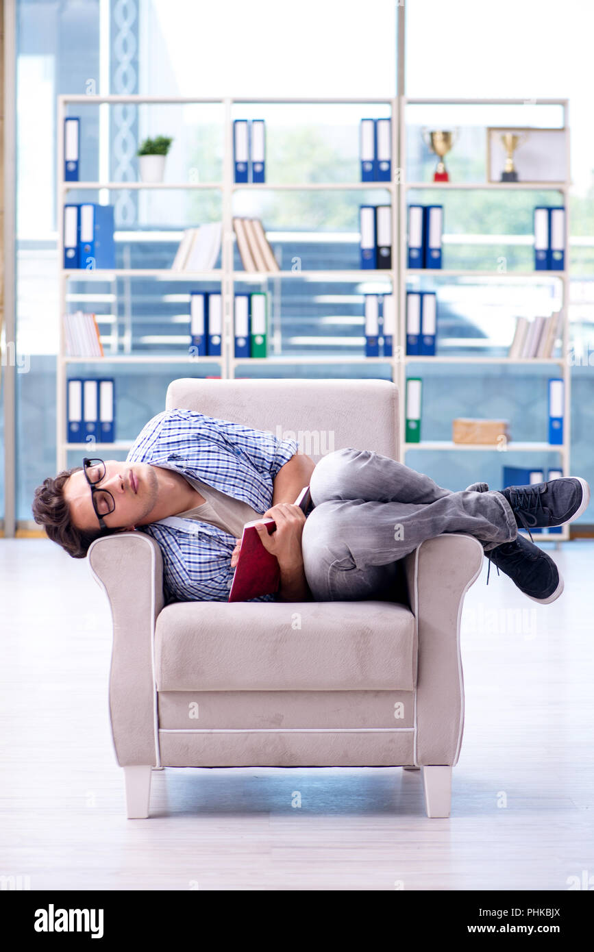 Student reading books and preparing for exams in library Stock Photo ...