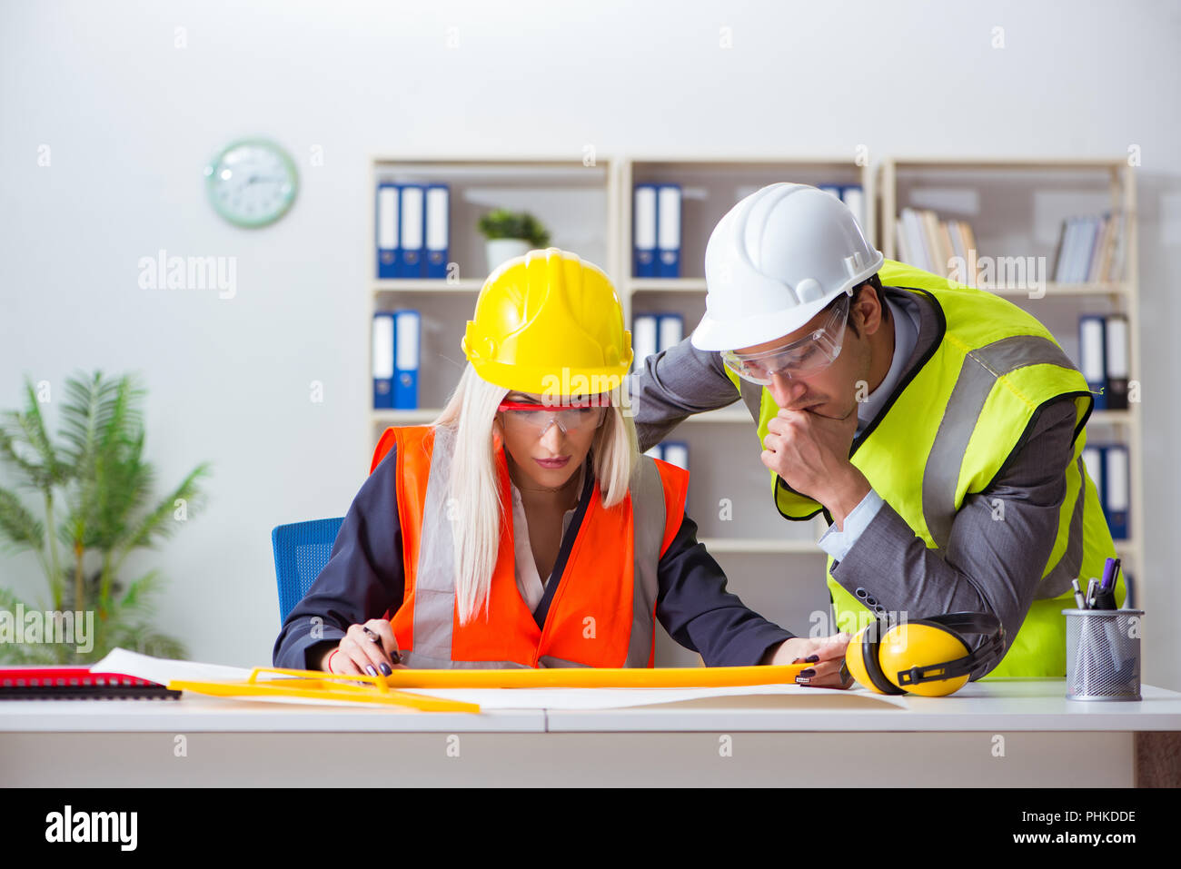 Construction workers checking drawing hi-res stock photography and ...