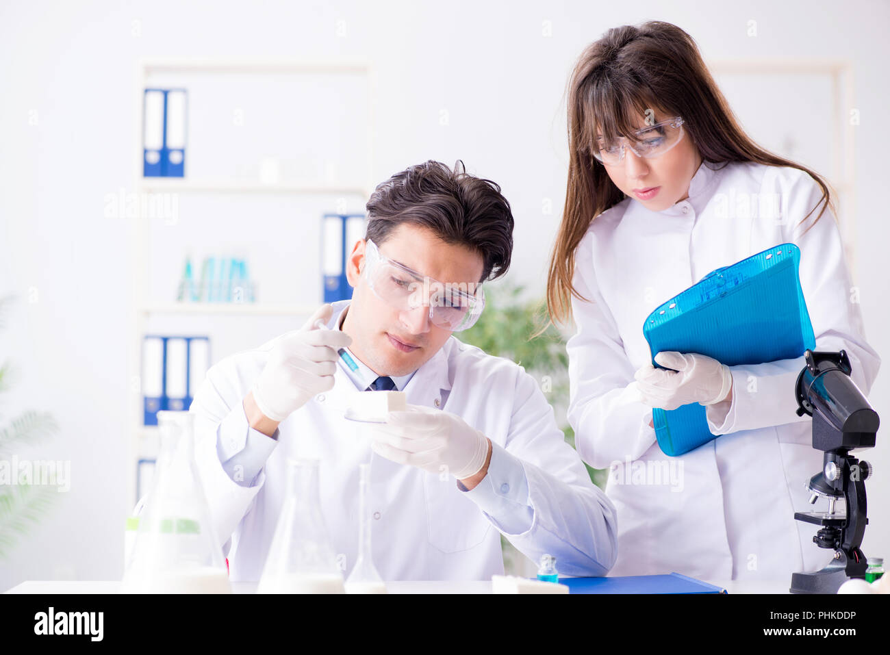 Two lab doctor testing food products Stock Photo - Alamy