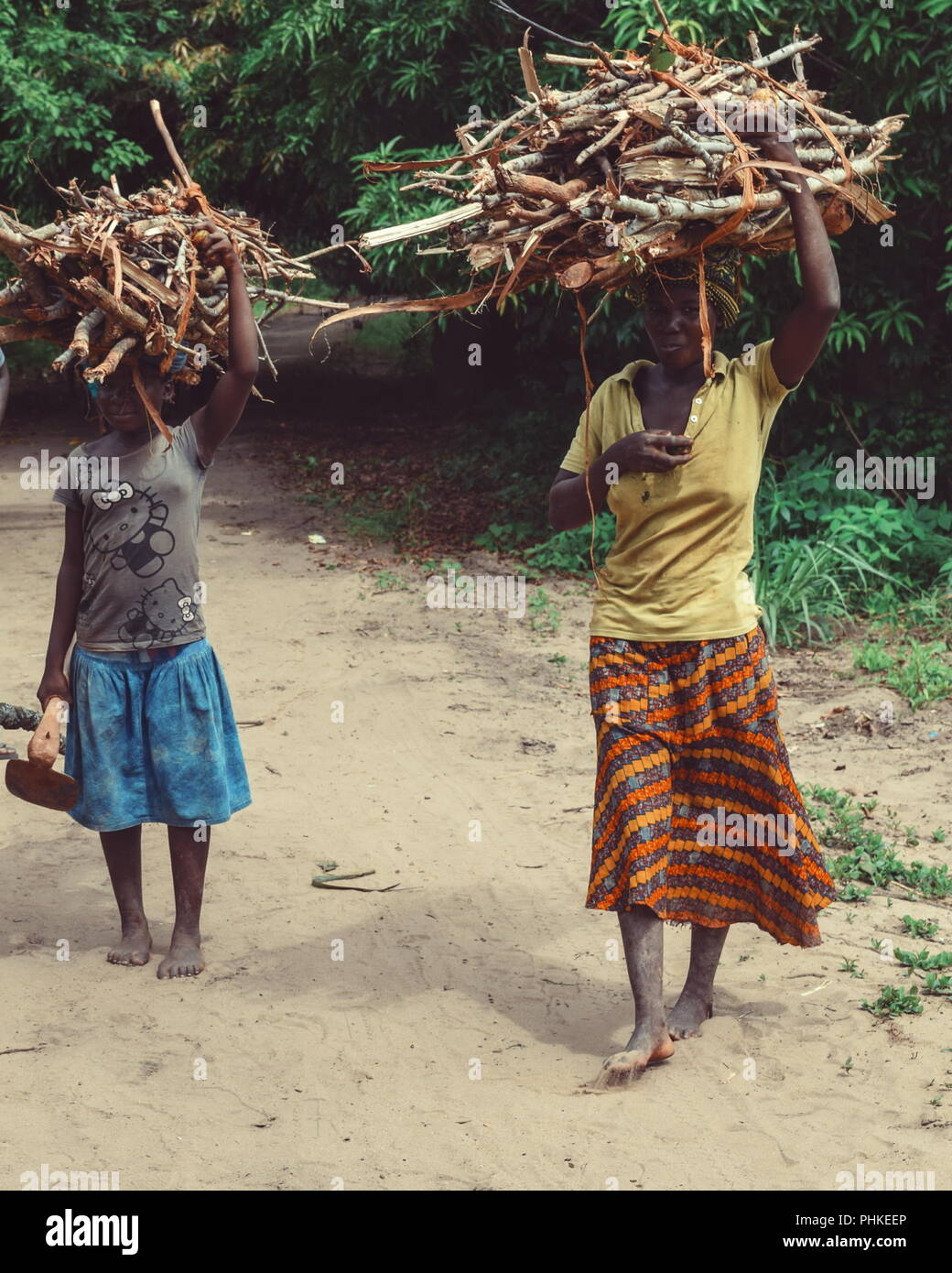 Young women collecting firewood at Kande Beach, Nkhata Bay, Malawi ...