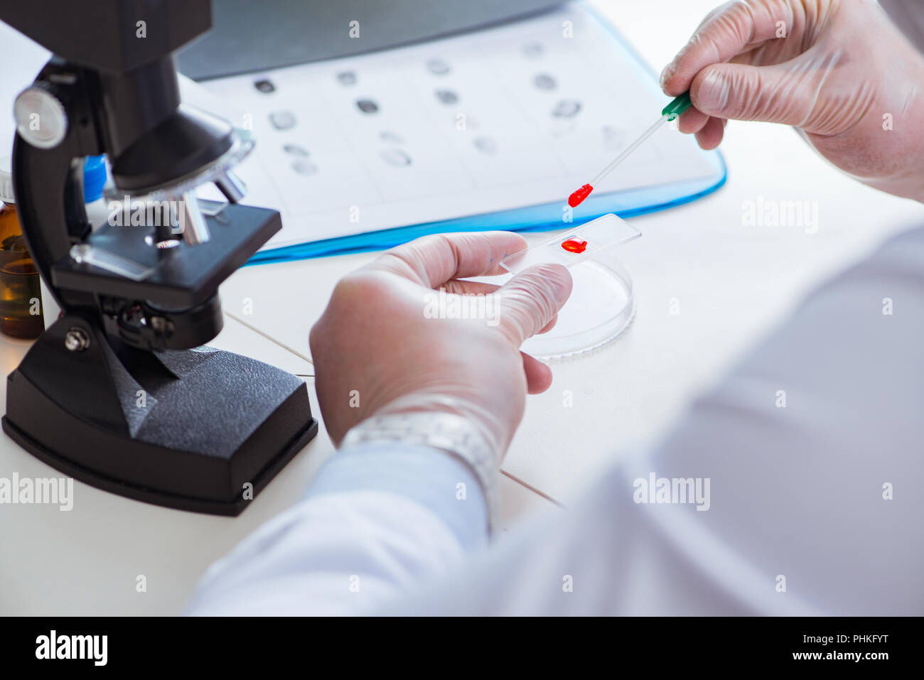 Drug synthesis lab experimentnig with pills Stock Photo - Alamy