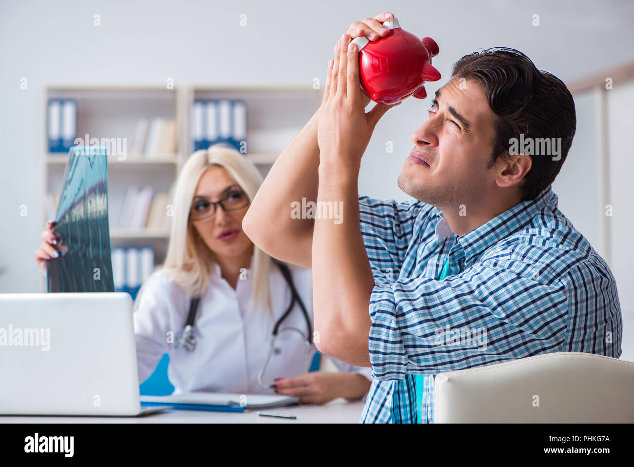 Male patient angry at expensive healthcare bill Stock Photo - Alamy
