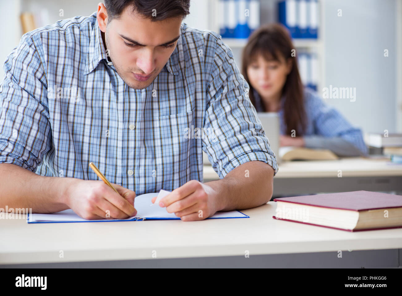Students sitting and studying in classroom college Stock Photo - Alamy
