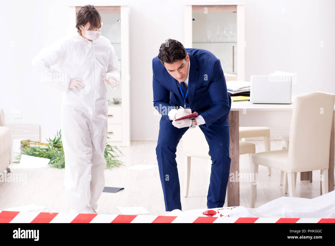 Forensics investigator at the scene of office crime Stock Photo - Alamy