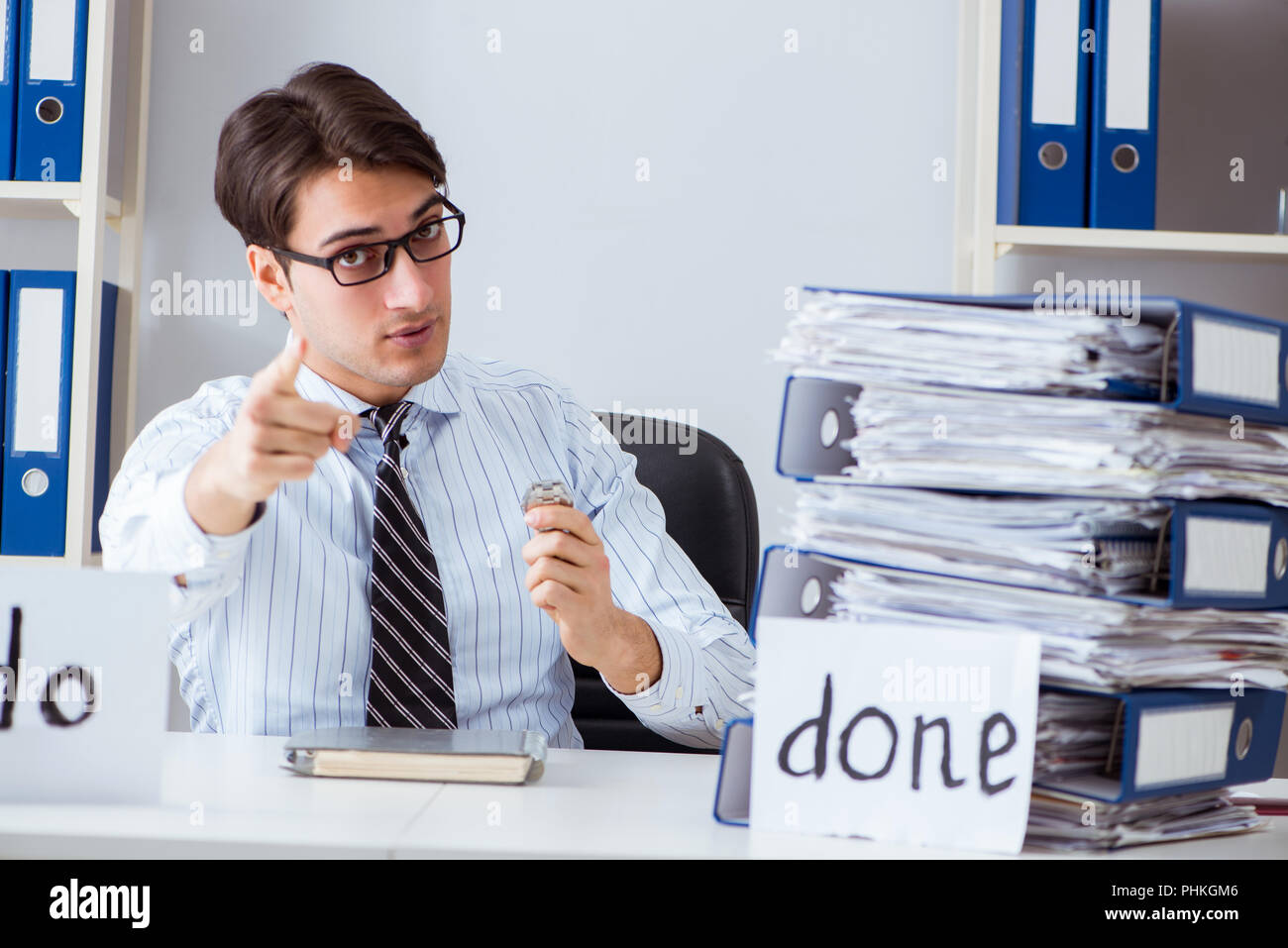 Businessman working on his to-do list Stock Photo - Alamy