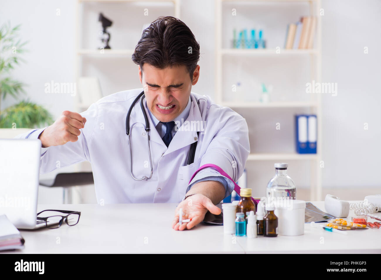 Doctor drug addict in the hospital Stock Photo - Alamy