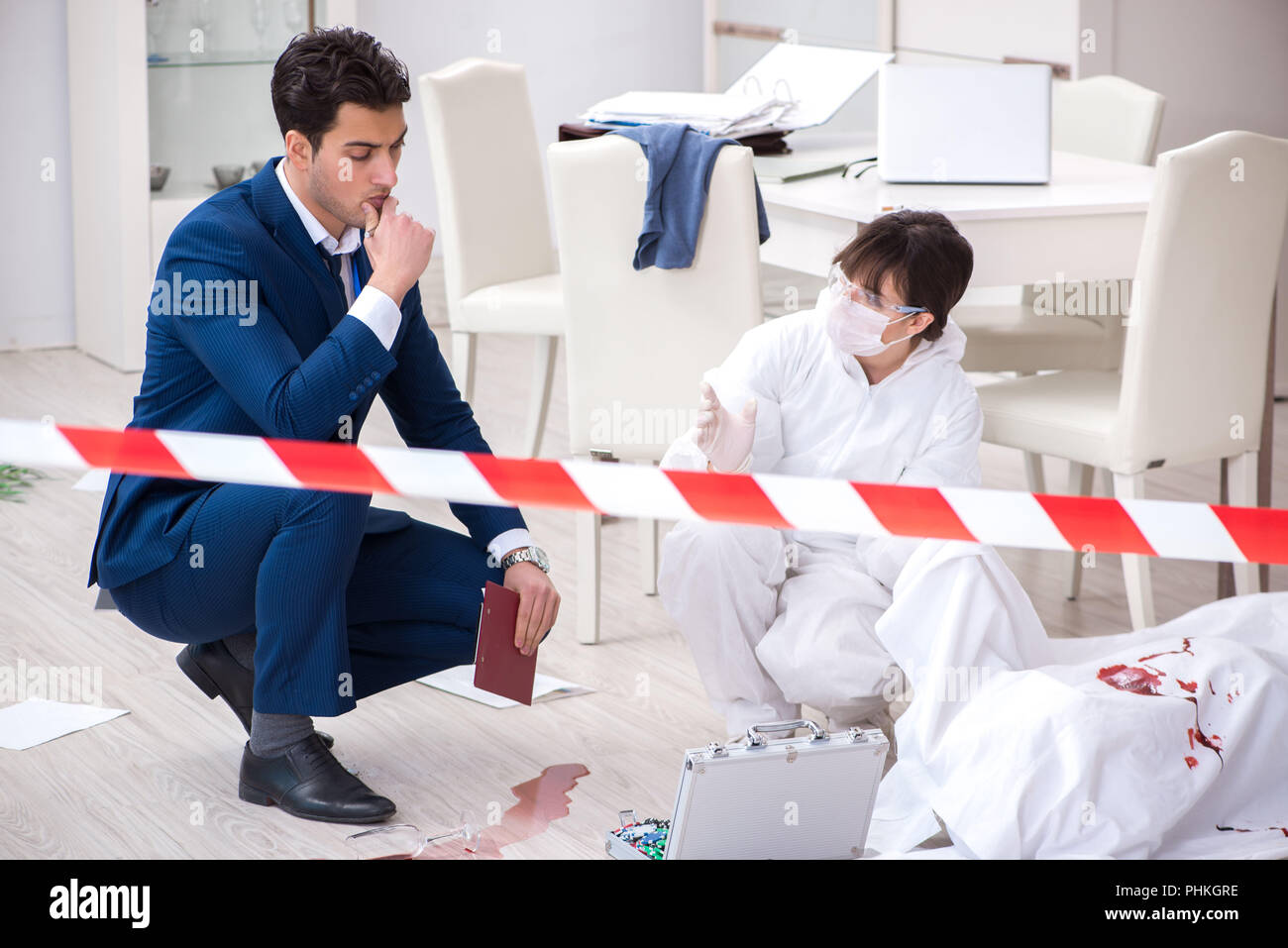 Forensics investigator at the scene of office crime Stock Photo - Alamy