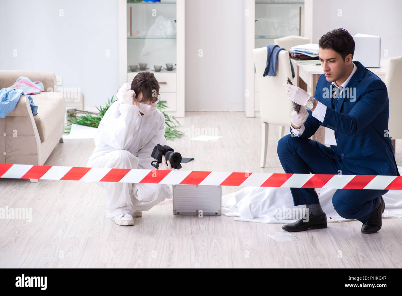 Forensics investigator at the scene of office crime Stock Photo - Alamy