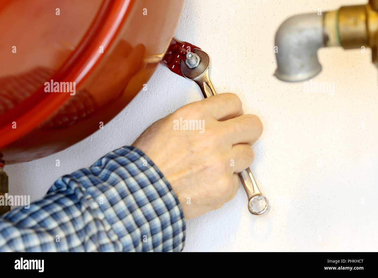 fixing a boiler Stock Photo - Alamy