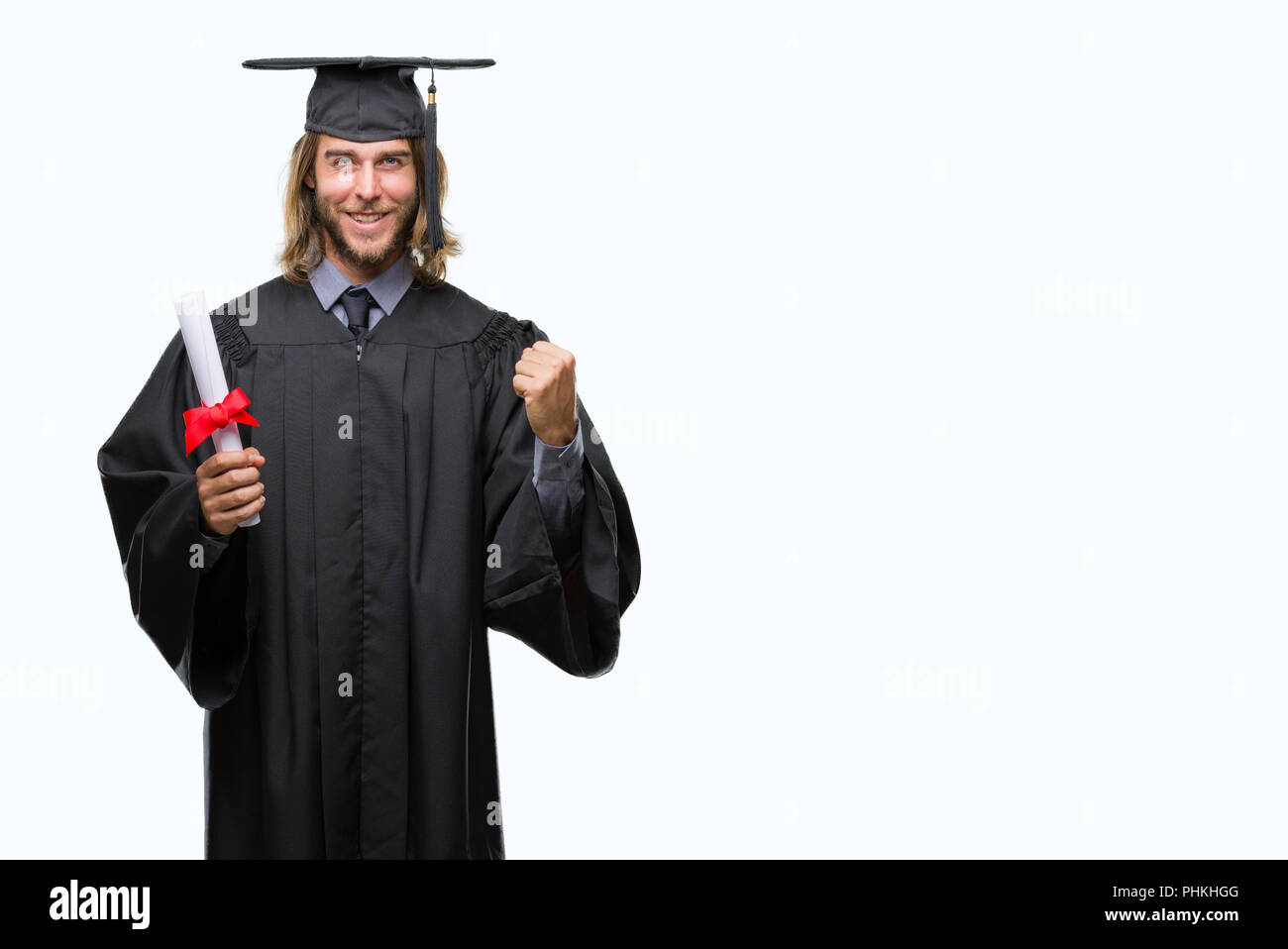 Young handsome graduate man with long hair holding degree over isolated ...